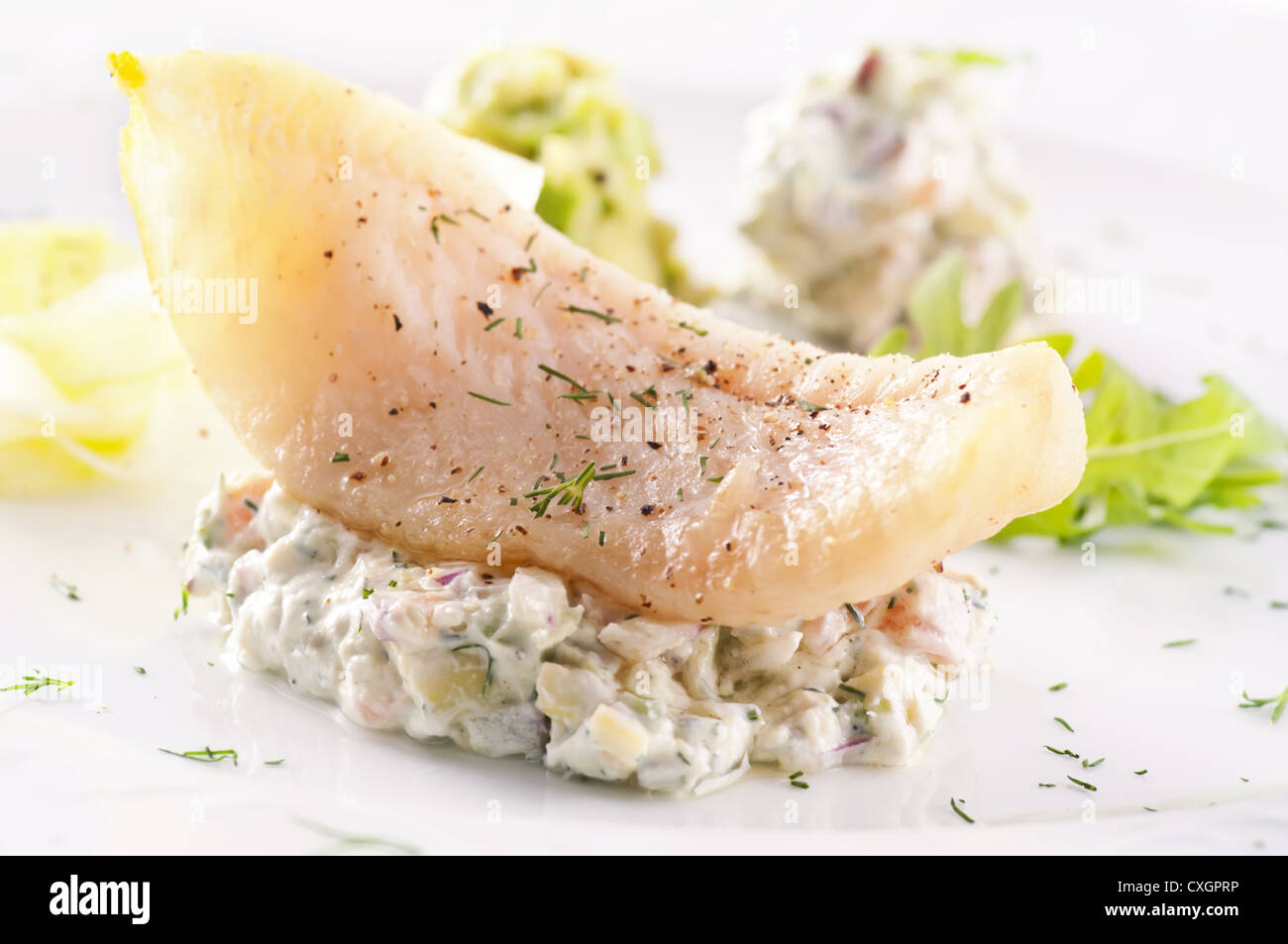 Fish fillet with avocado cream Stock Photo - Alamy