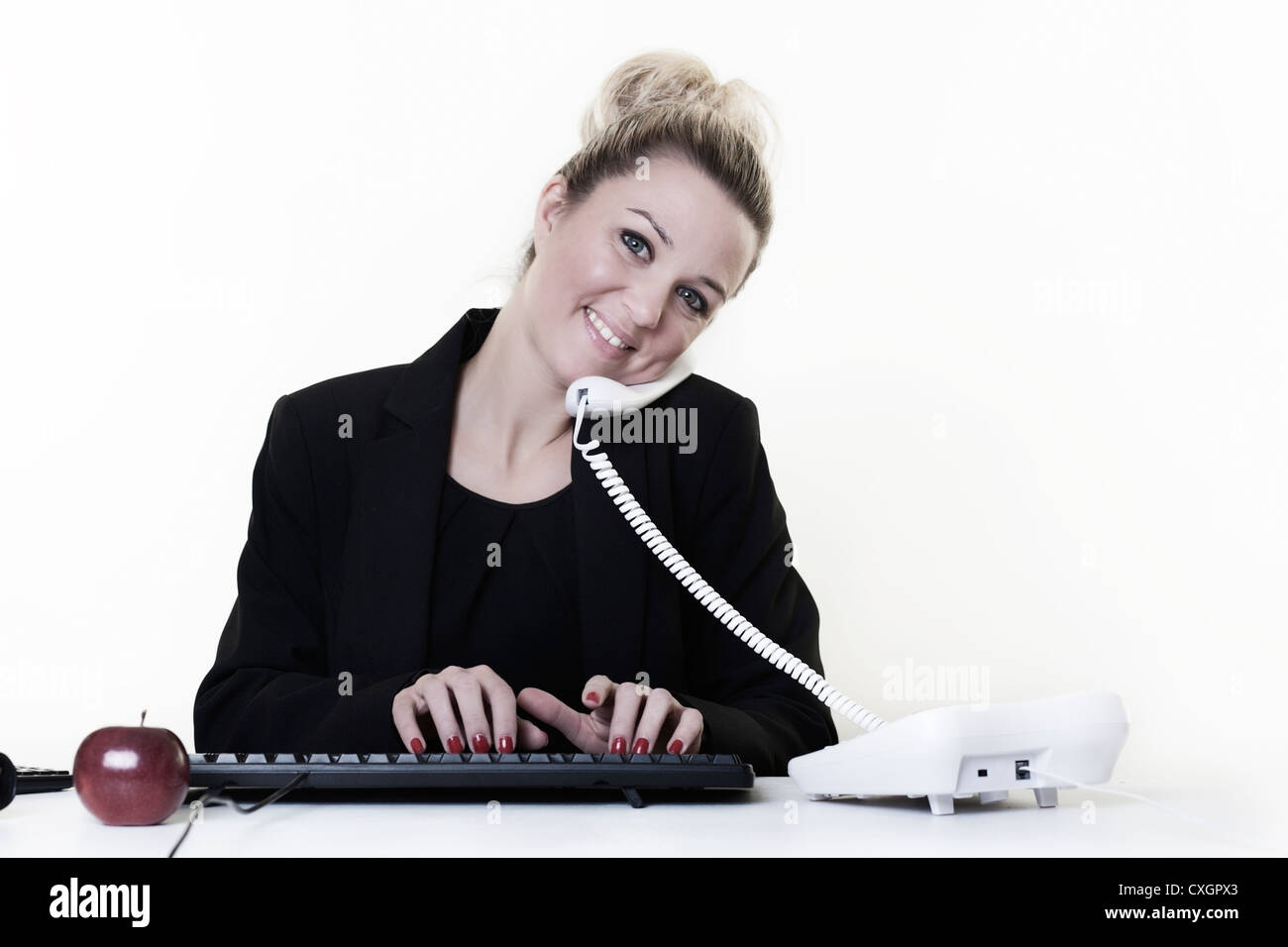 businesswoman working very hard at hes desk Stock Photo - Alamy