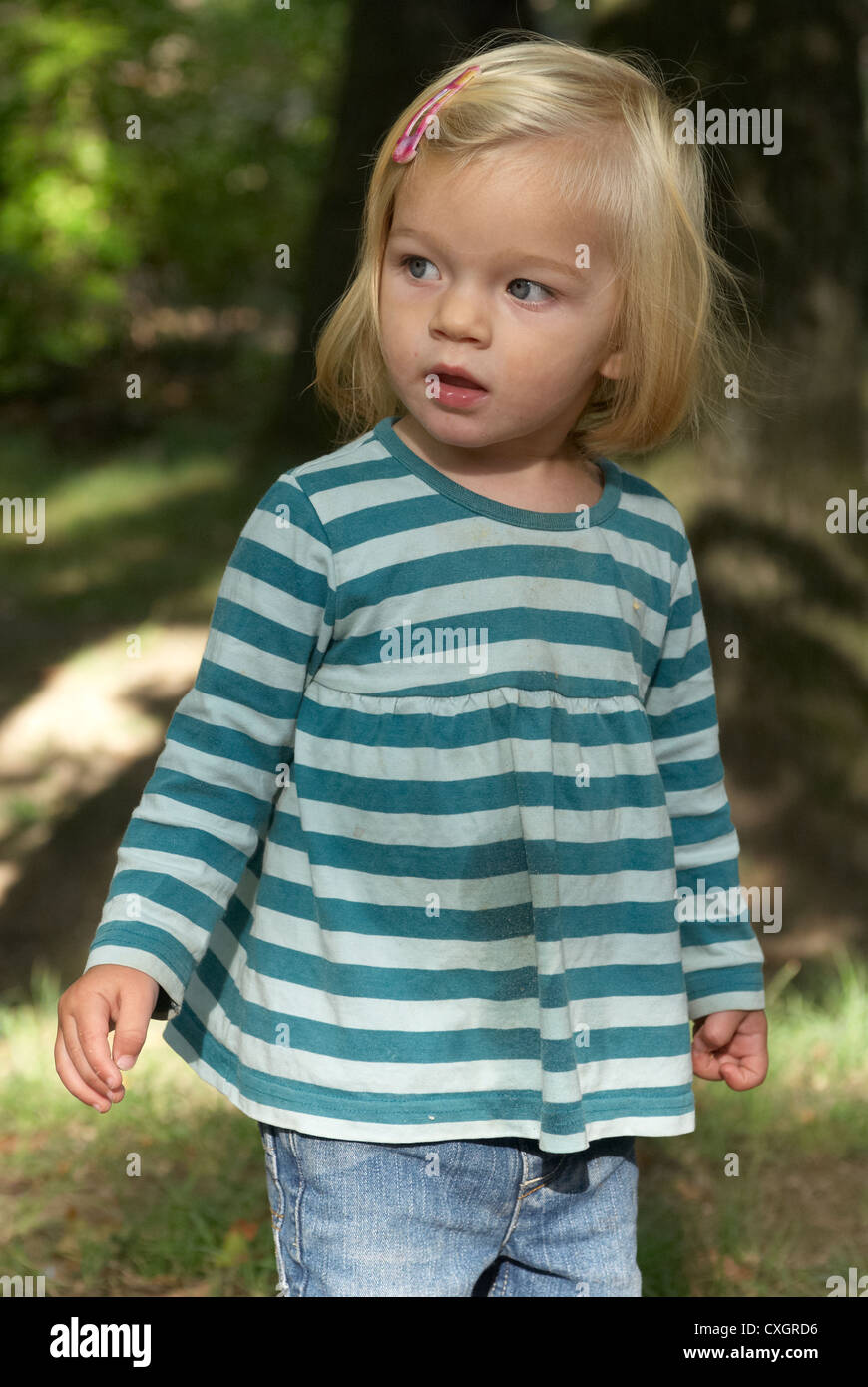 Adorable Blue Eyed Girl Playing Outside In The Summer Forest Stock