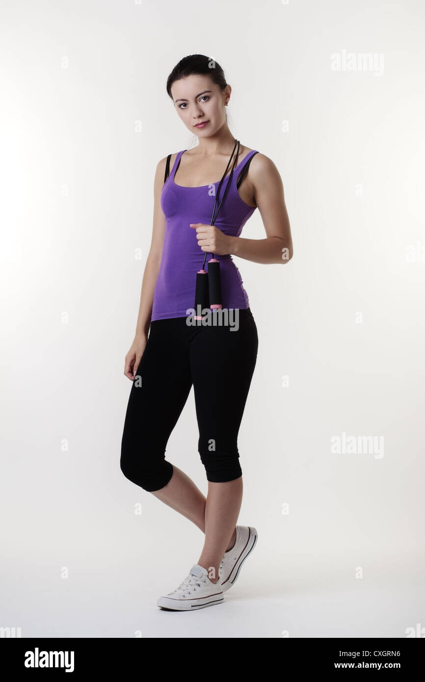 young woman with a skipping rope in her exercise clothes Stock Photo ...
