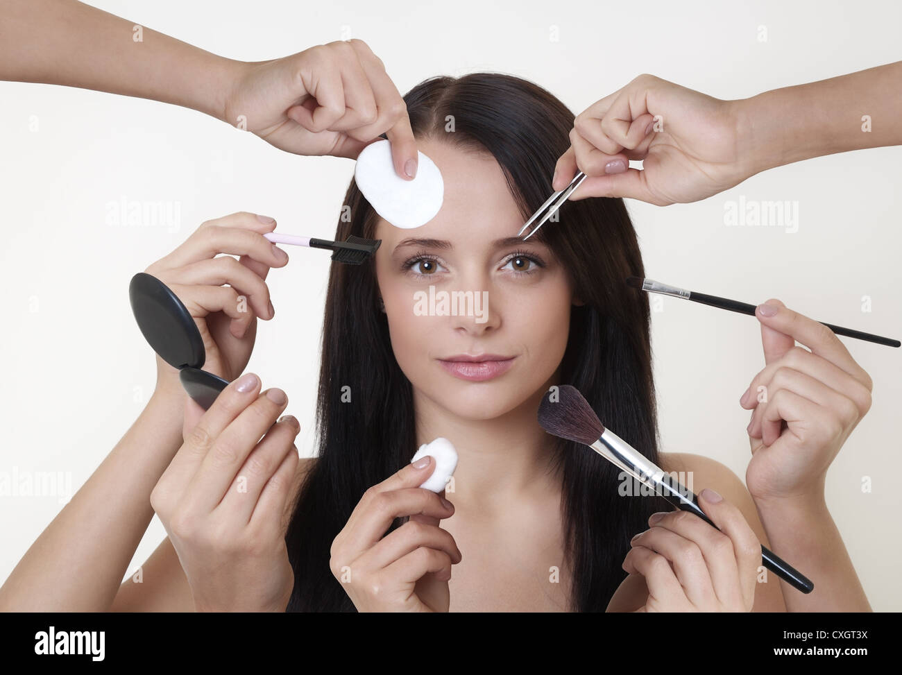 woman doing make up with many hands and arms helping her get the job ...