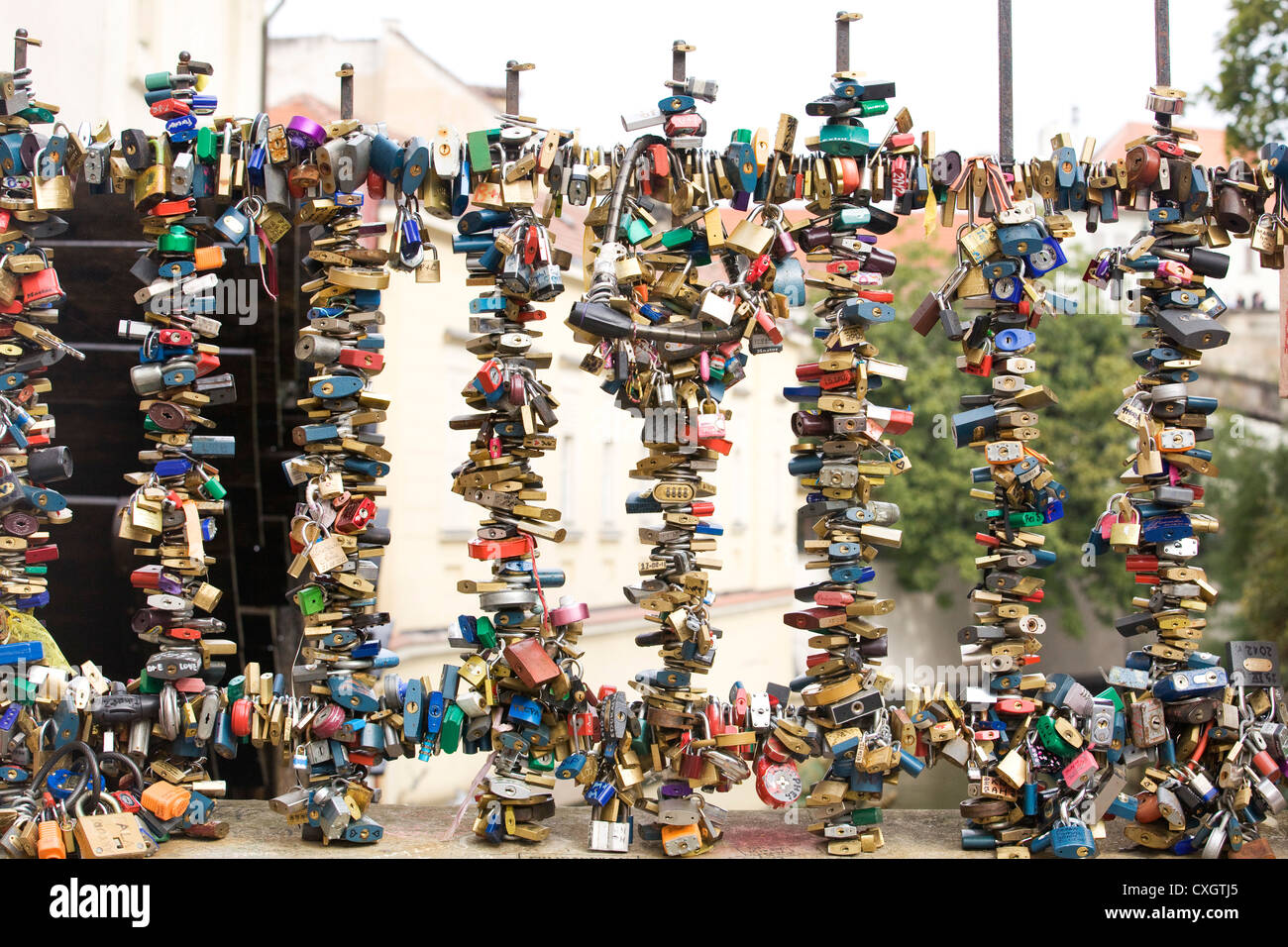 Love padlocks affixed to a fence gate or bridge by sweethearts to ...