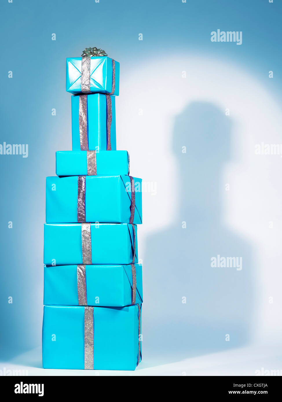 Pile of presents, stacked blue gift wrapped boxes in a shape of an ...