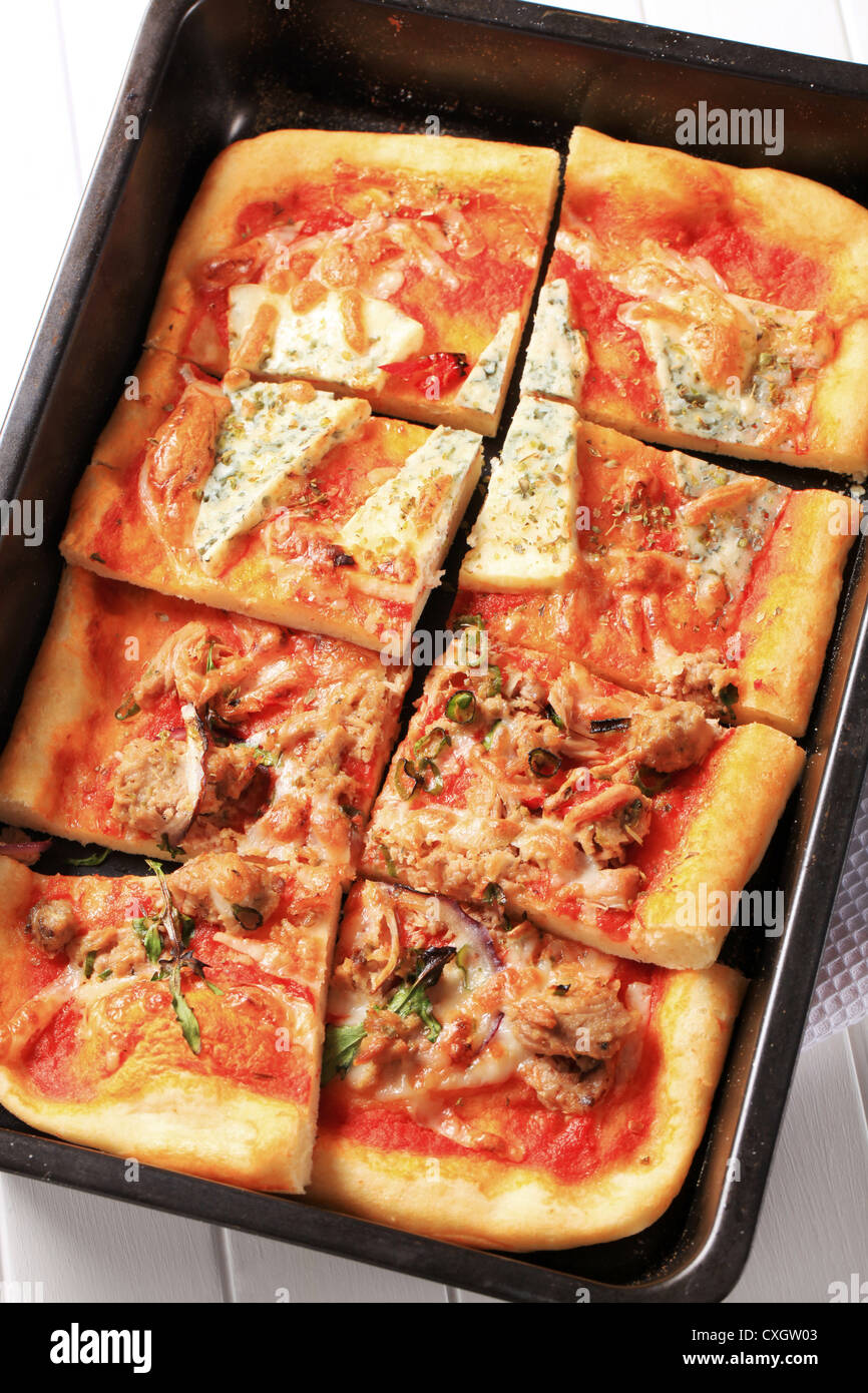 Rectangular pizza topped with blue cheese and tuna Stock Photo - Alamy