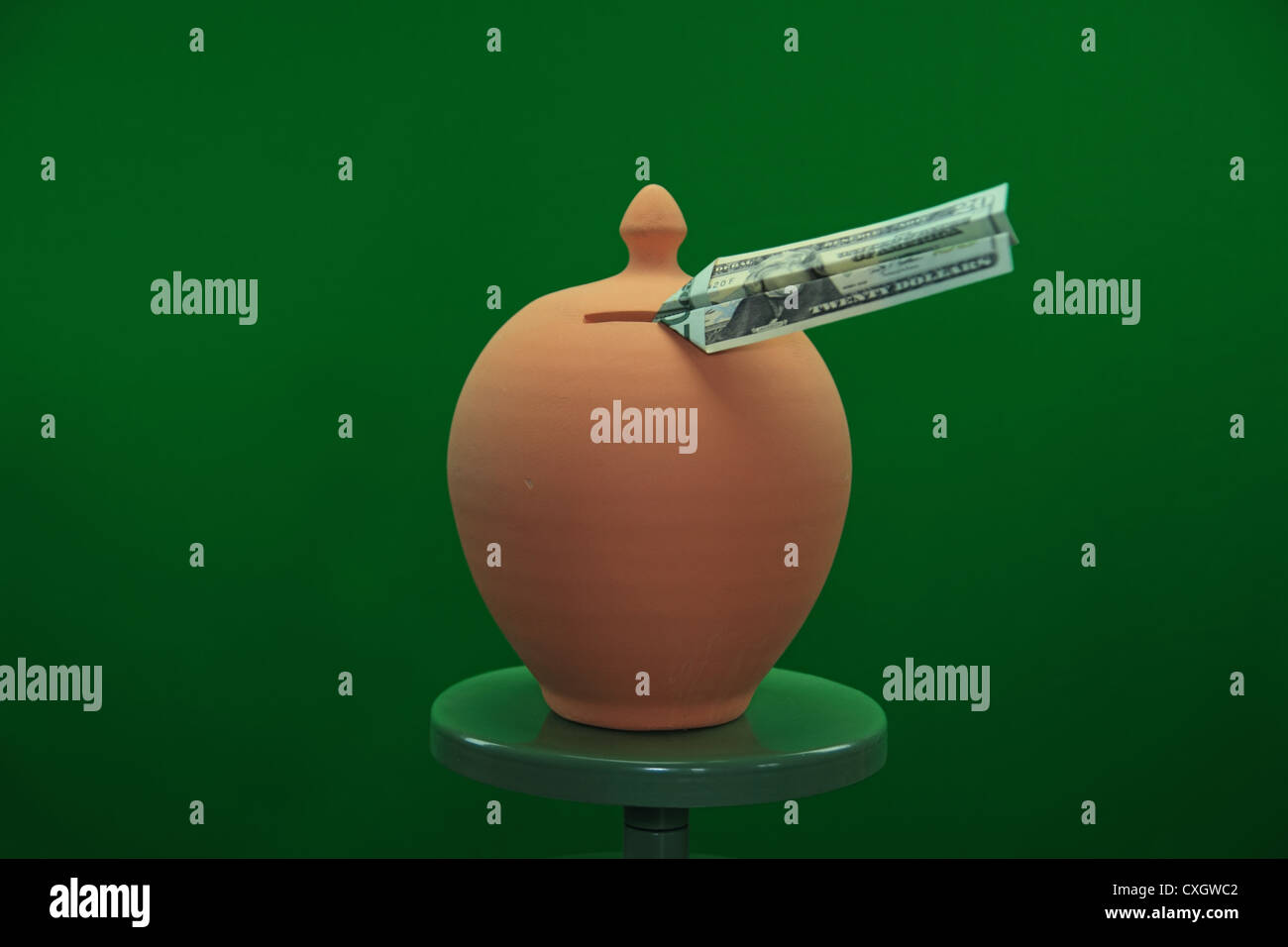 dollar bill flying in a money box Stock Photo - Alamy