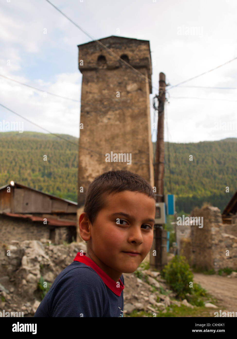 Young boy with koshkebi in Mestia Stock Photo - Alamy