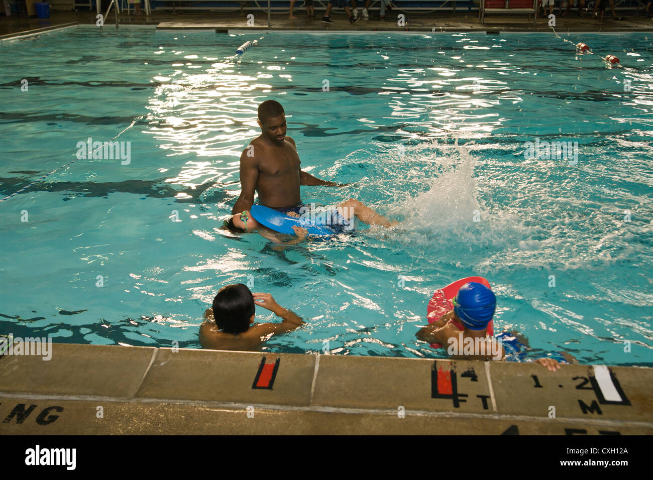 Swimming lesson and teacher hi-res stock photography and images - Alamy