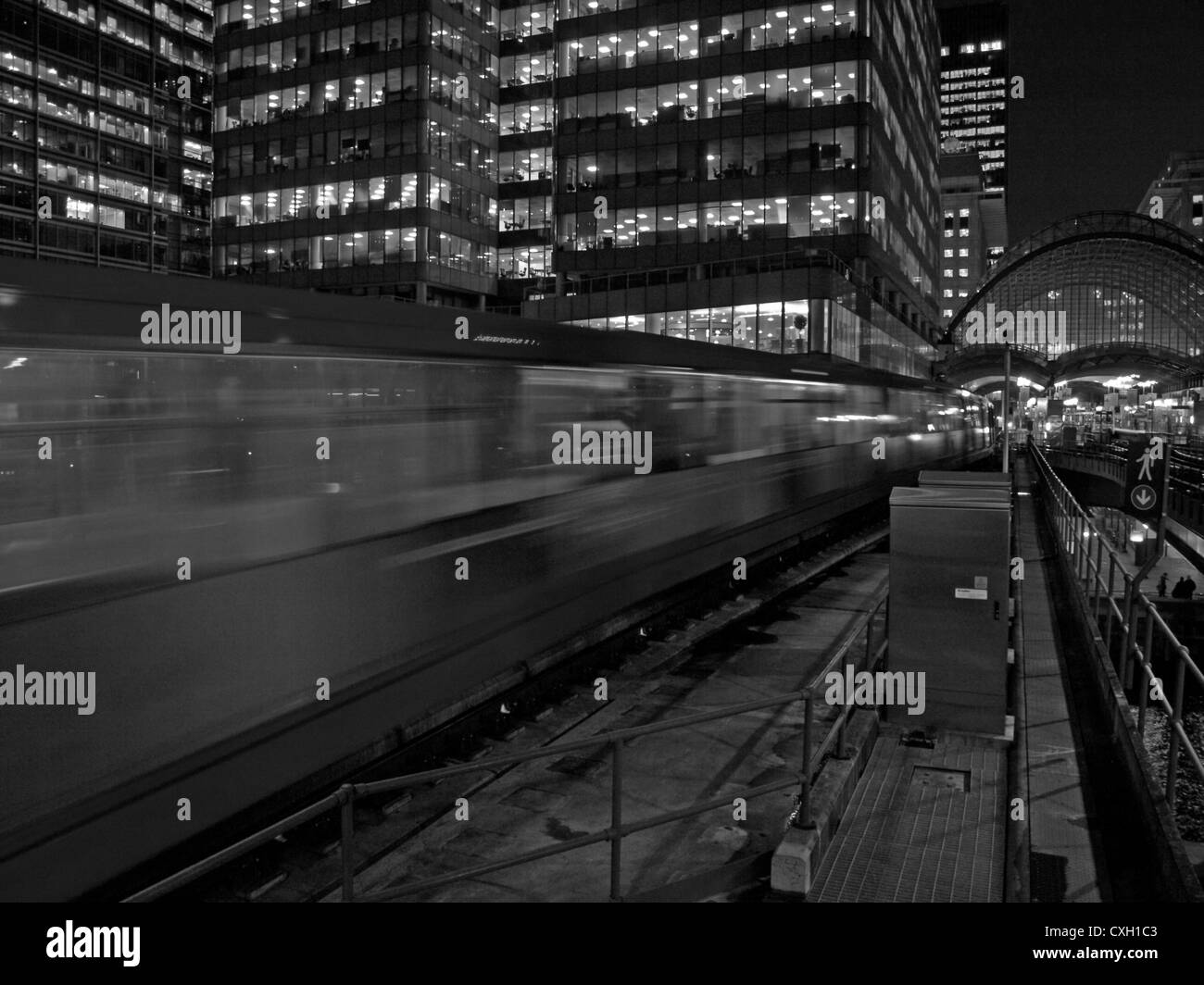 Illuminated train buildings night architecture Black and White Stock ...