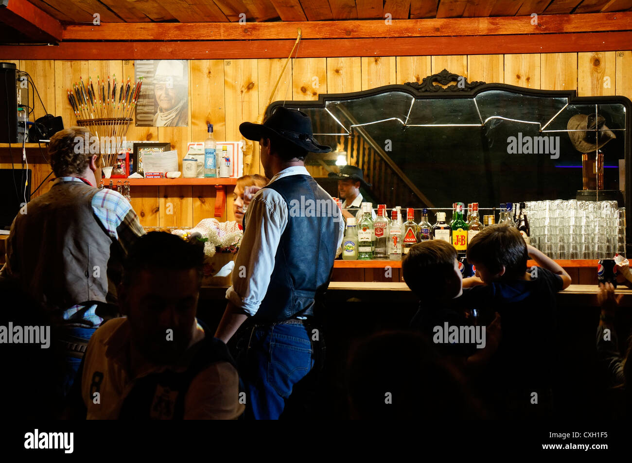 Inside of a replica of a wild west saloon. Cowboys in an old western ...