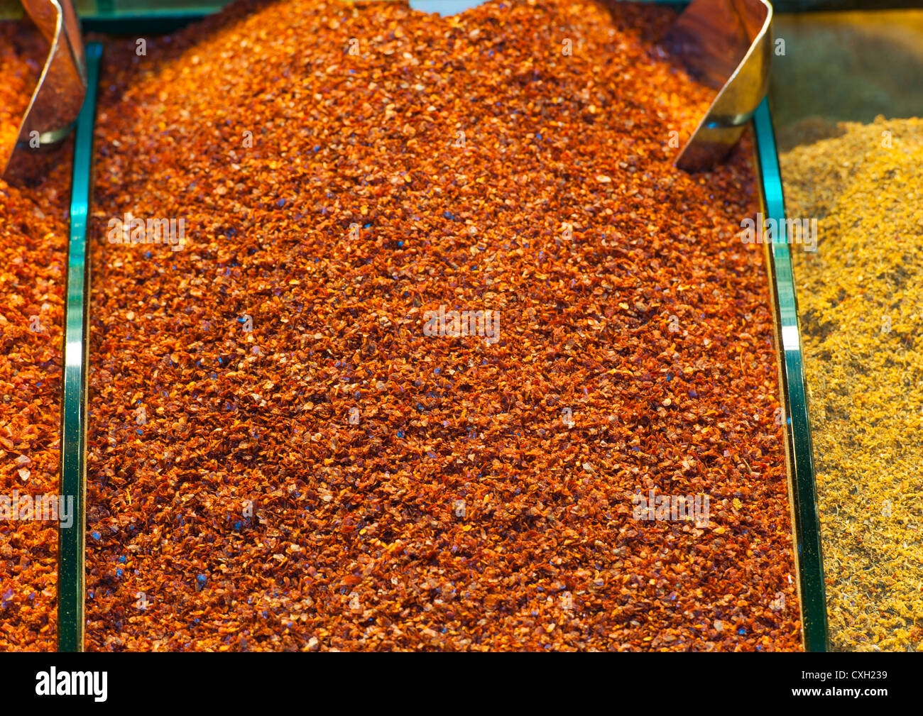 Various spices on display at an indoor market stall Stock Photo - Alamy