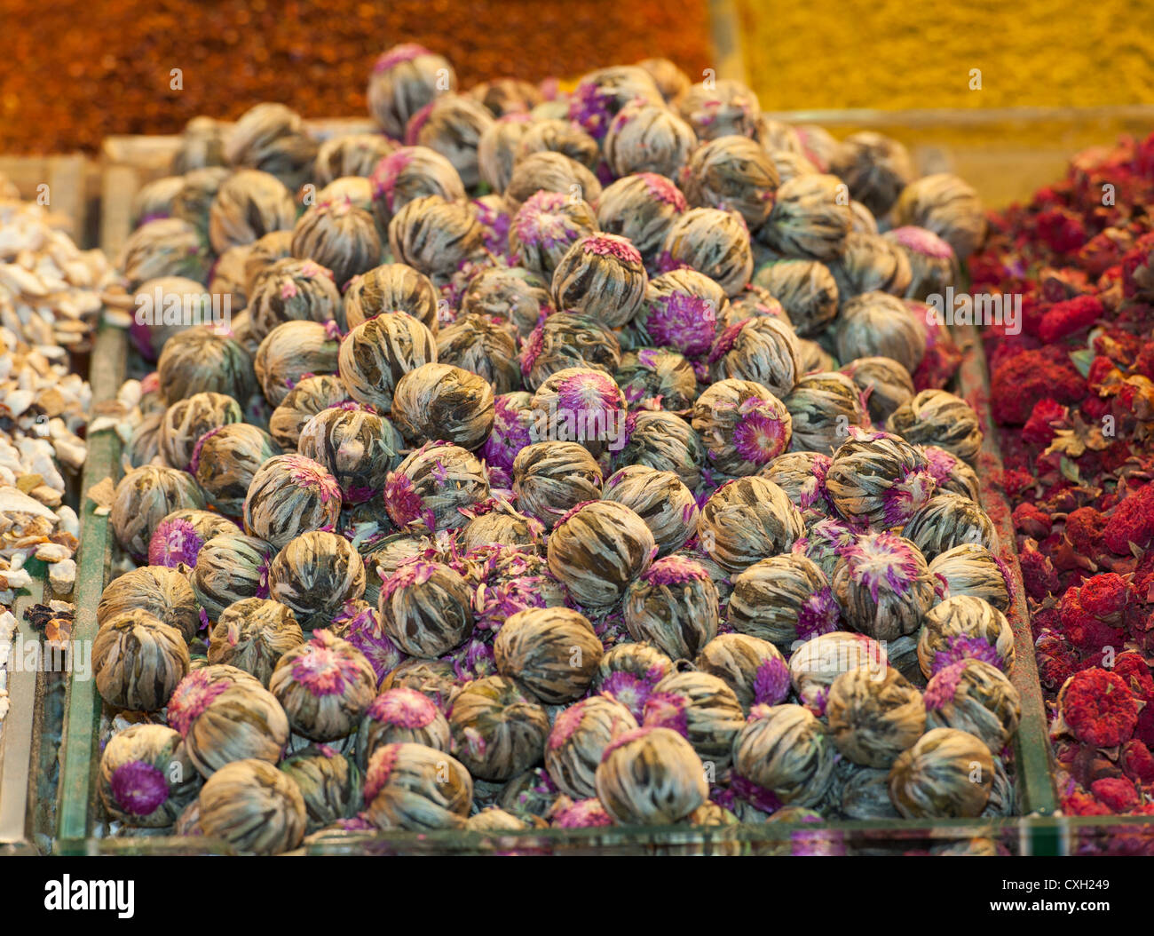 Various spices on display at an indoor market stall Stock Photo - Alamy