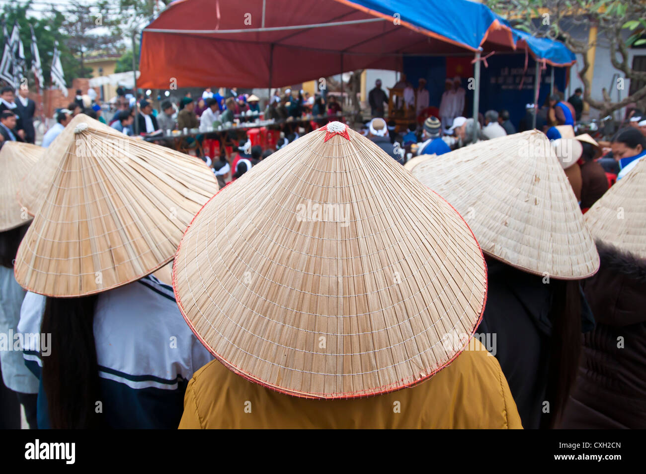 Wearing conical straw hats hi-res stock photography and images - Alamy