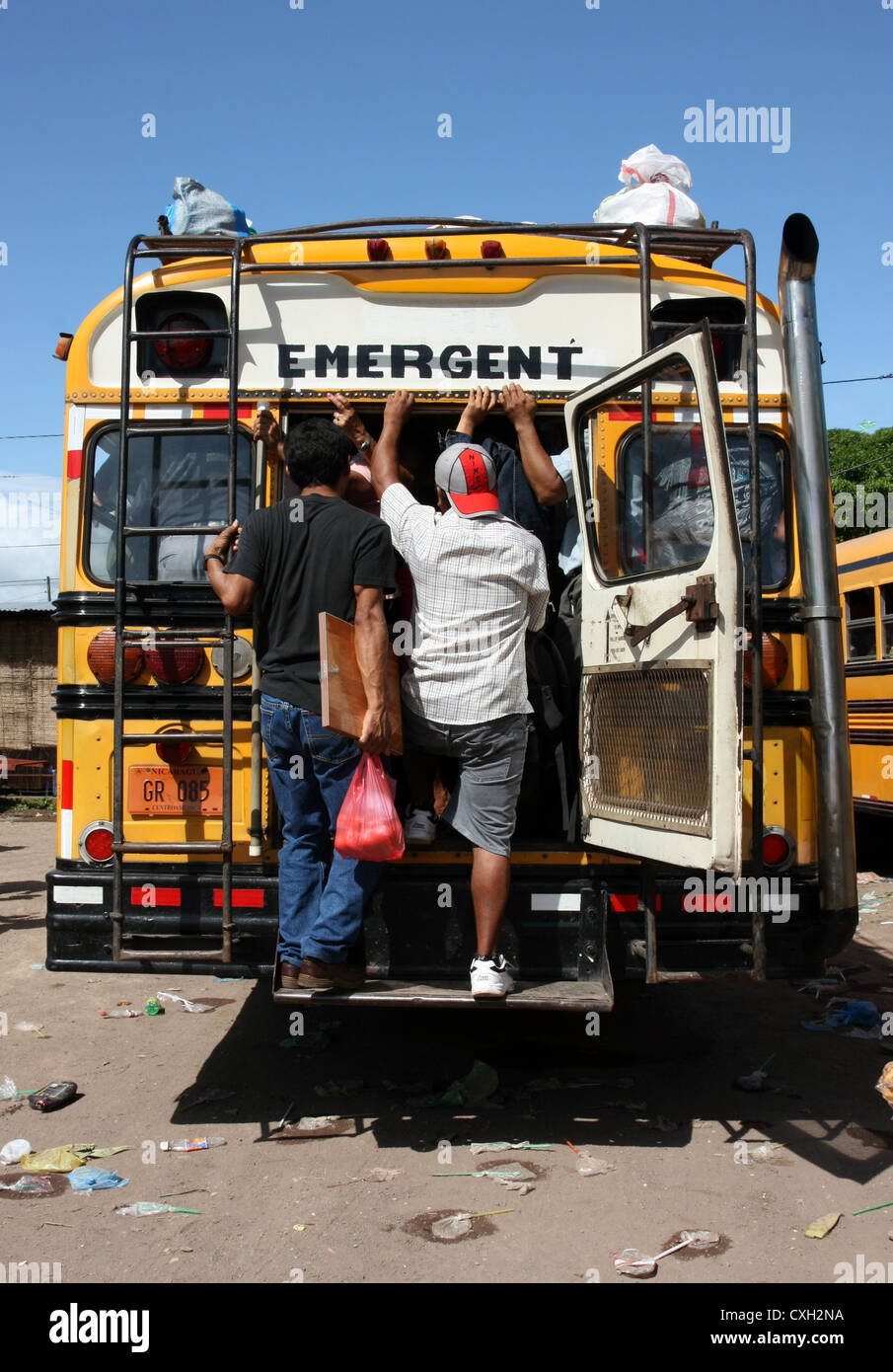 Brightly decorated public buses (chicken buses) at Masaya bus station ...