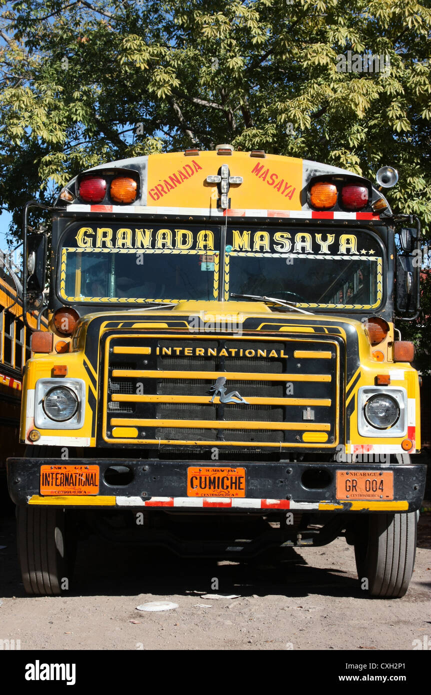 Brightly decorated public buses (chicken buses) at Masaya bus station ...