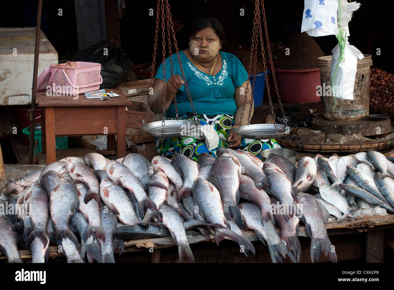 A vendor selling fish at an outdoor market in Bago Burma Myanmar Stock ...