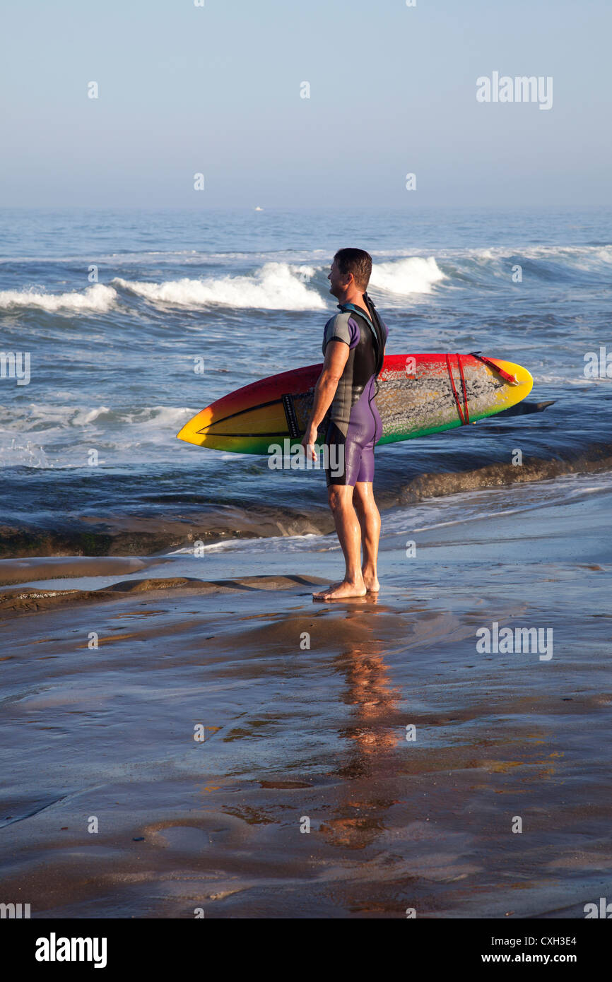 Man getting ready to surf, La Jolla, near San Diego, California Stock ...