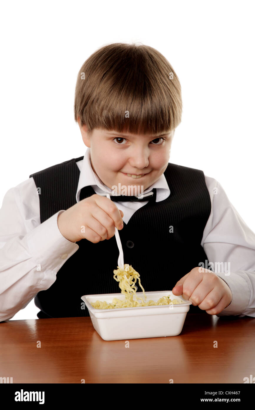 Boy eating instant noodles hi-res stock photography and images - Alamy