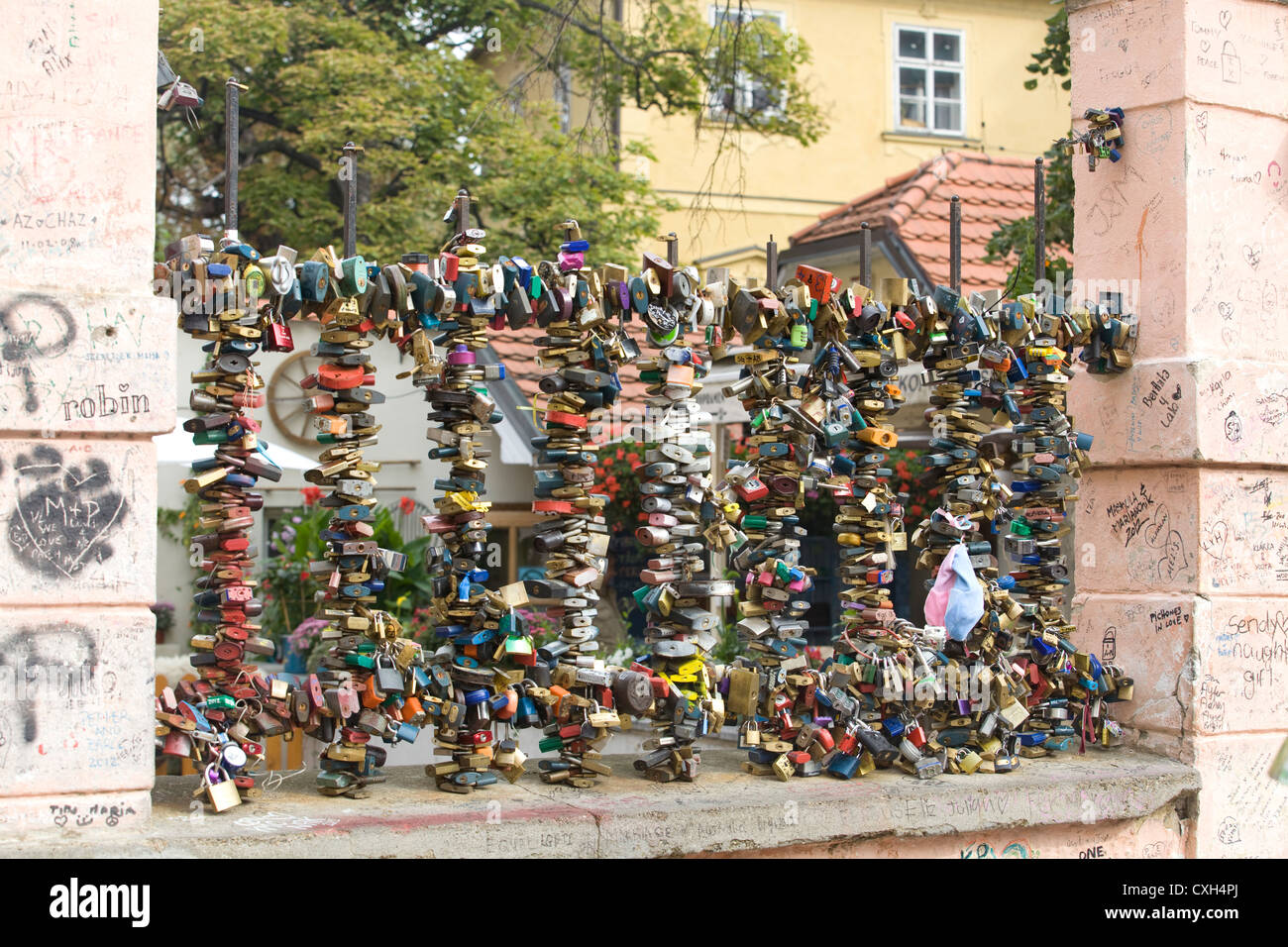 Love padlocks affixed to a fence gate or bridge by sweethearts to ...