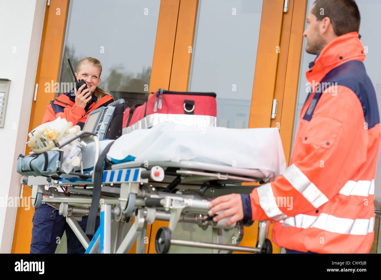 Paramedics emergency home visit call radio ambulance doctor help Stock ...