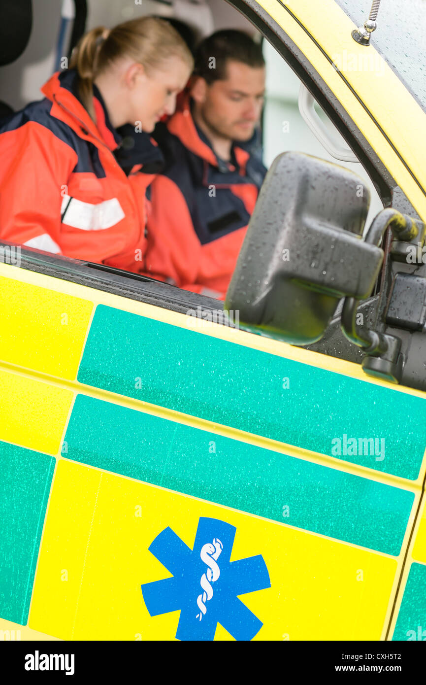 Emergency ambulance car paramedics sitting medical work female doctor ...
