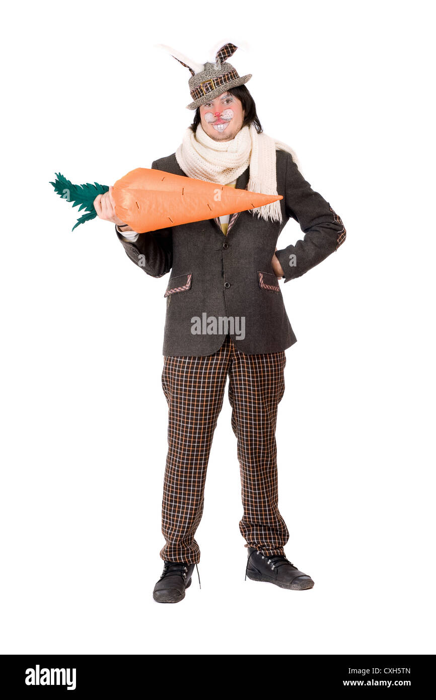 Smiling young man with carrot Stock Photo - Alamy