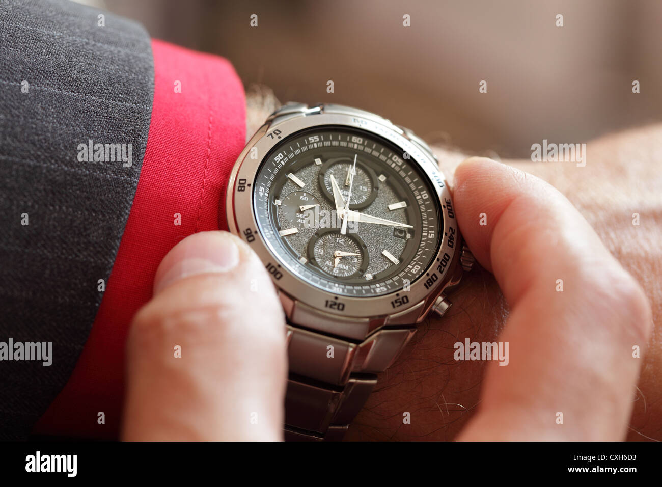 Checking the time Stock Photo - Alamy