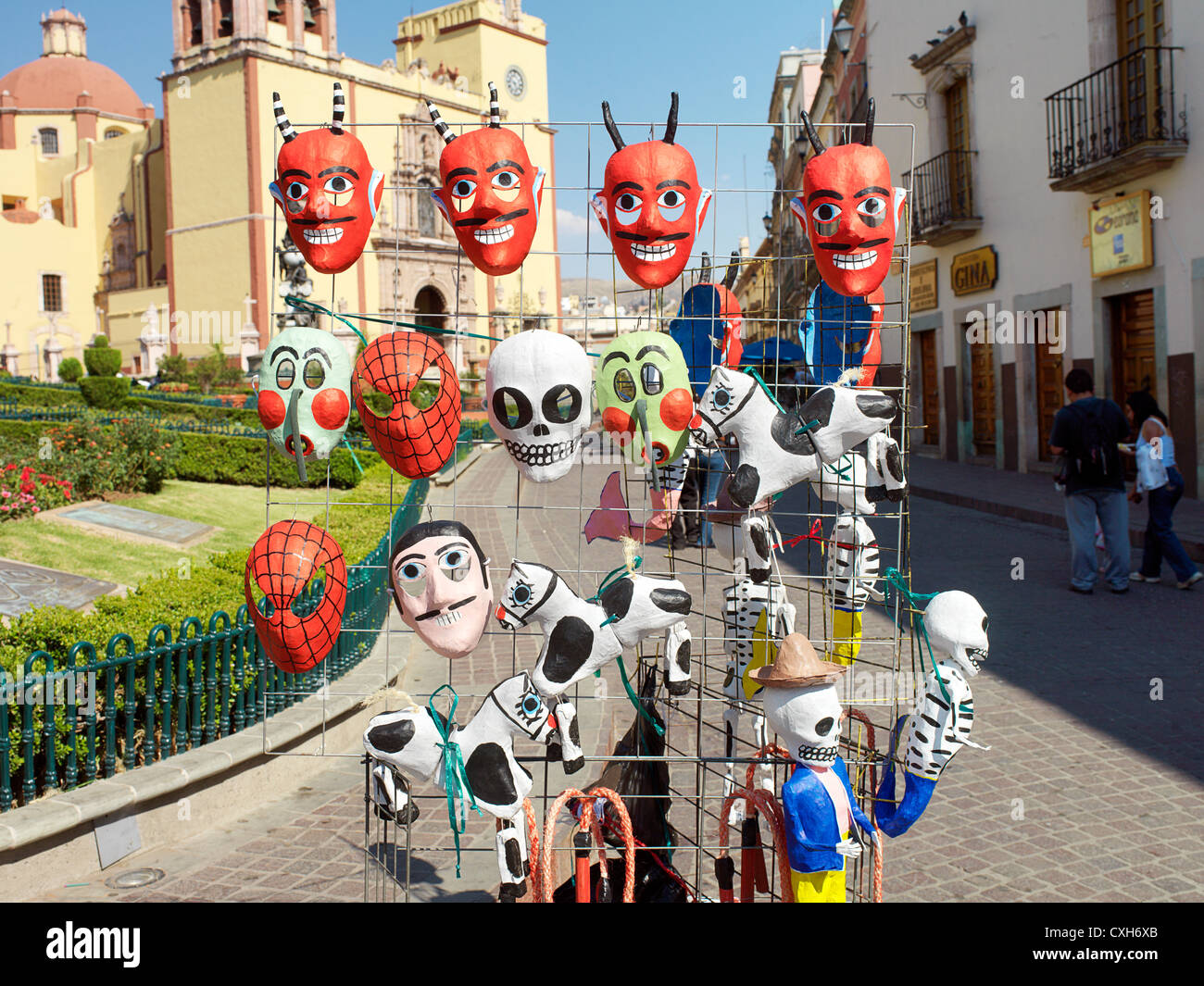 Mexican masks of good and evil outside the main church Stock Photo - Alamy