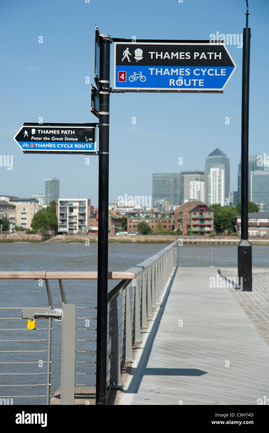 Direction signs with Thames and office buildings in background Stock ...