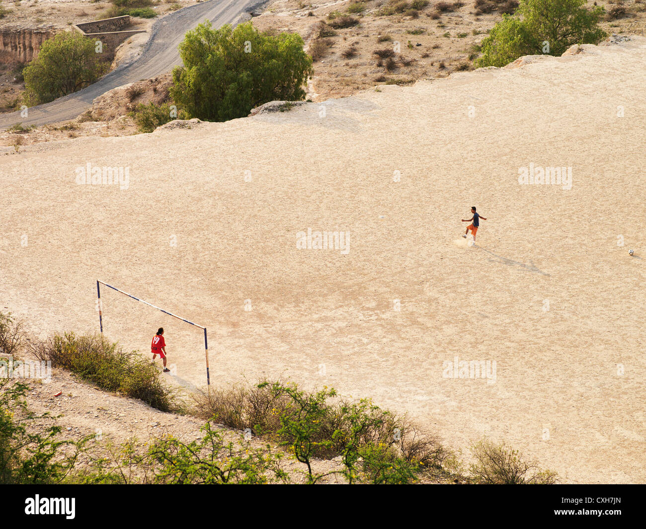 Football (soccer) played on a dirt field in the middle of nowhere in ...