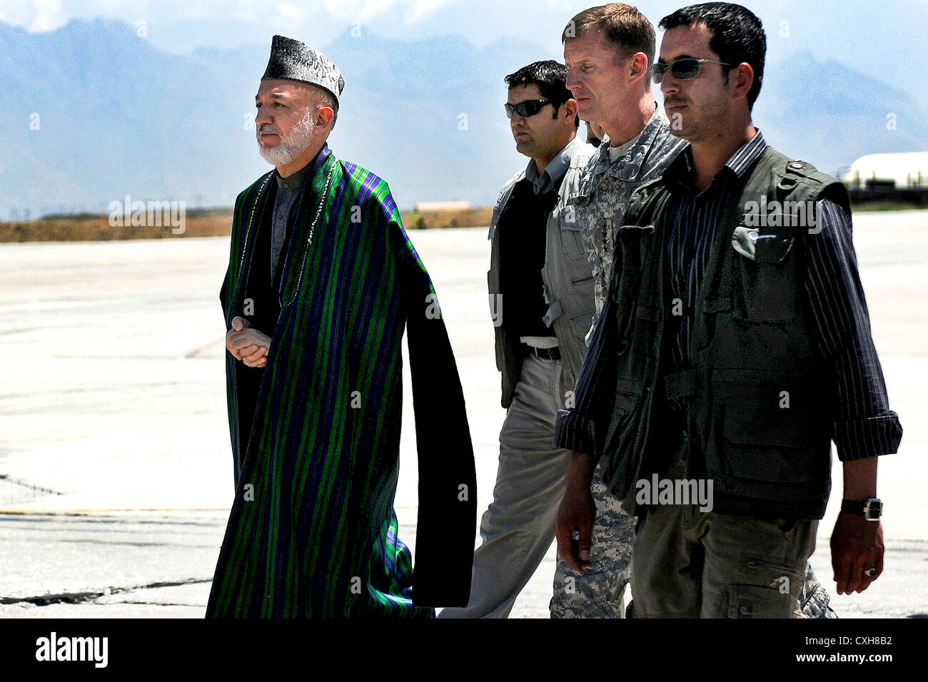 Afghan President Hamid Karzai walks with US Army General Stanley ...