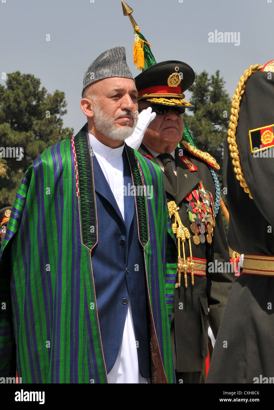 Afghan President Hamid Karzai stands with Defense Minister Gen. Abdul ...
