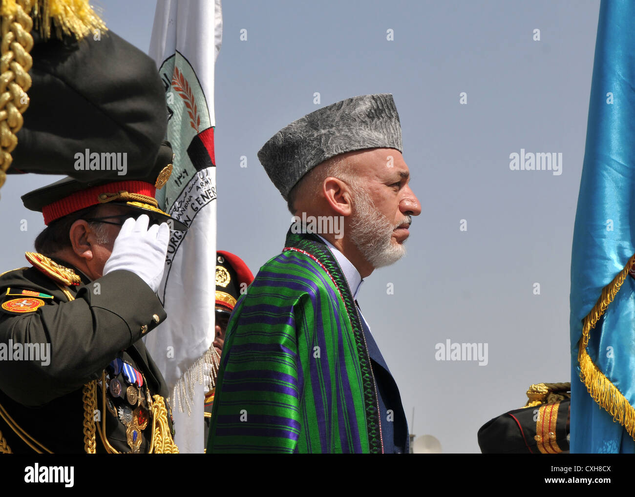 Afghan President Hamid Karzai stands with Defense Minister Gen. Abdul ...