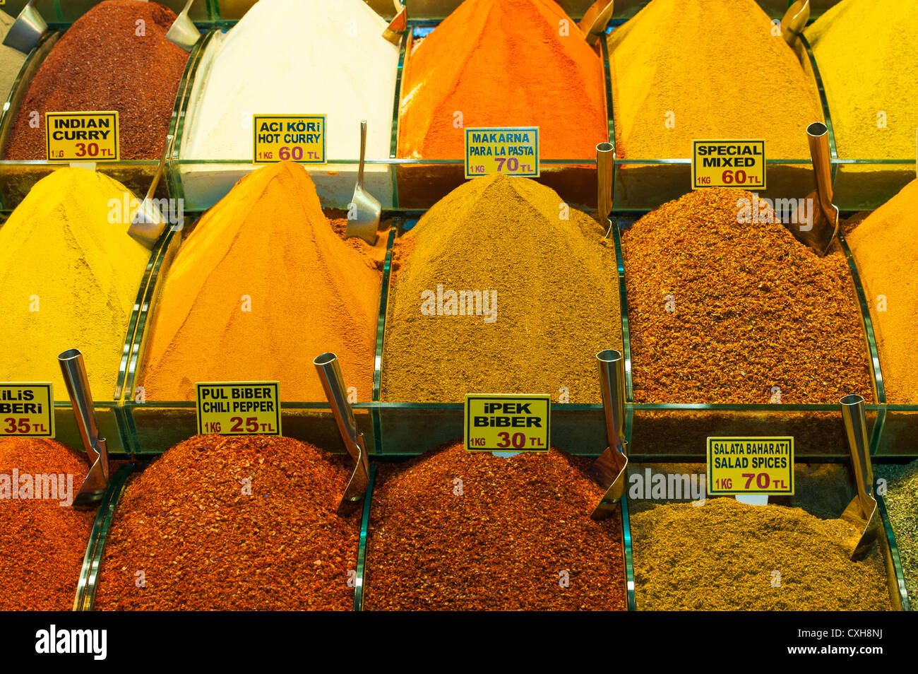 Various spices on display at an indoor market stall Stock Photo - Alamy