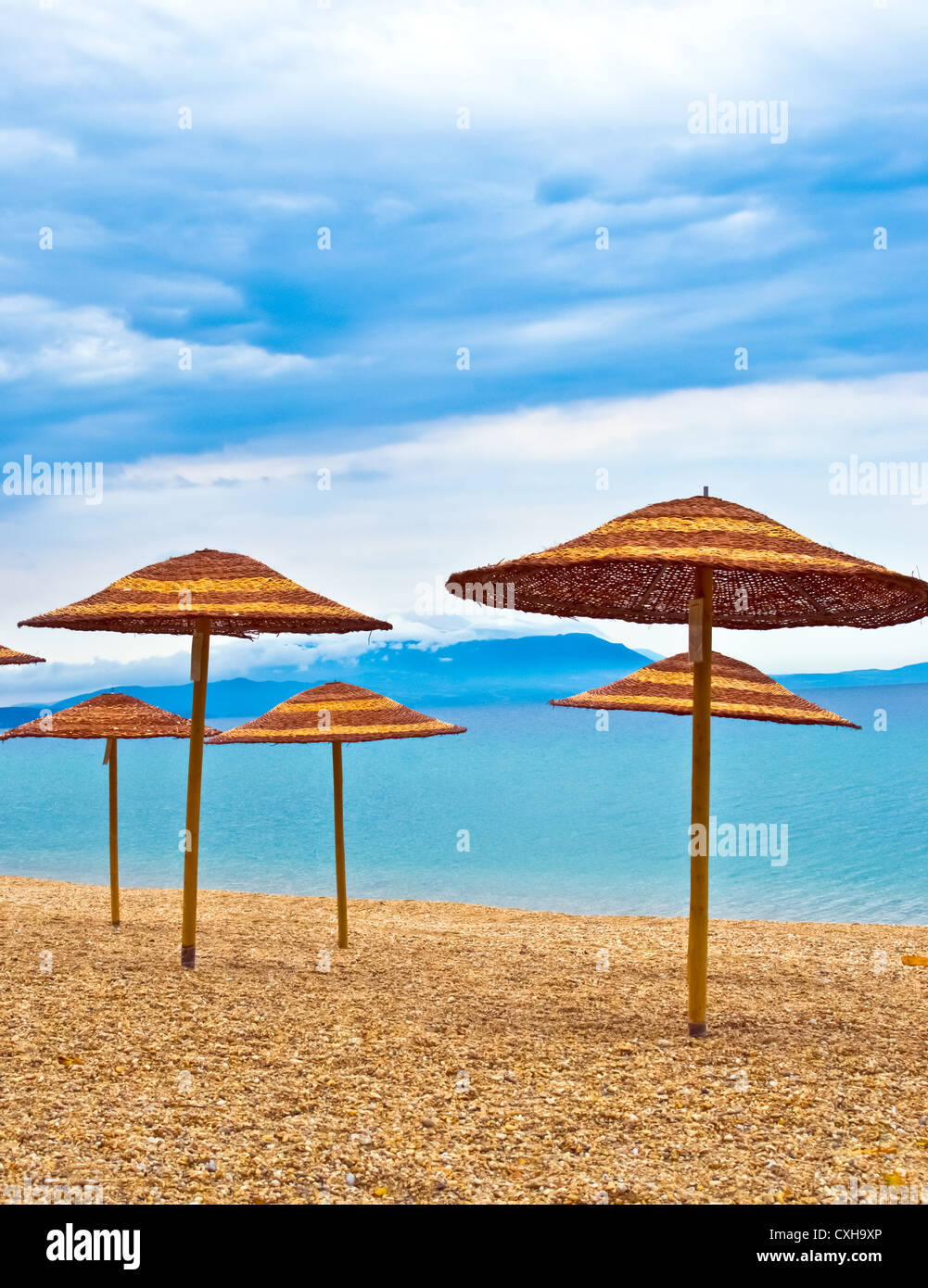 Caribbean tropical beach straw umbrella hi-res stock photography and ...