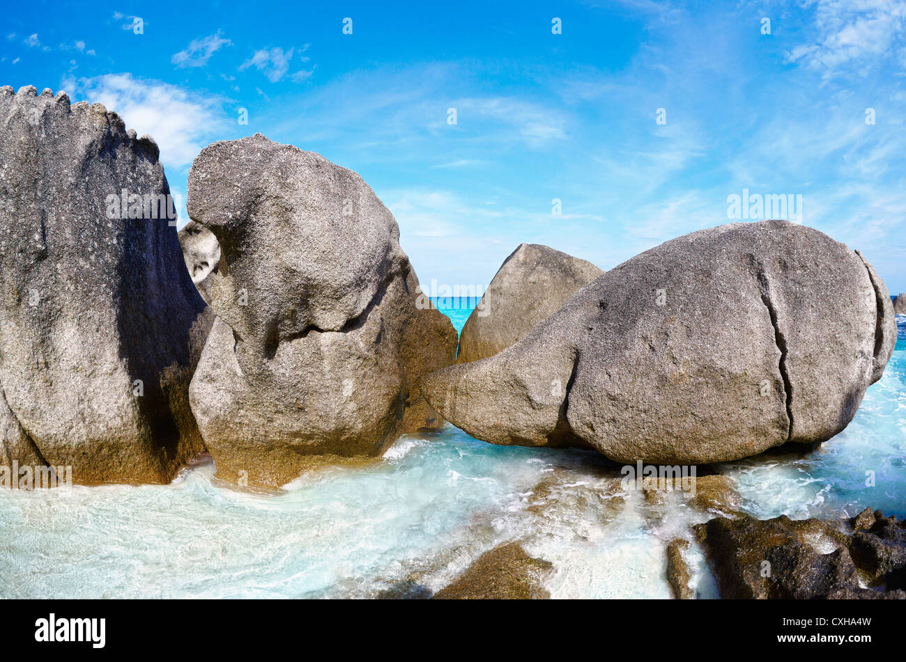 Boulders and ocean Stock Photo - Alamy