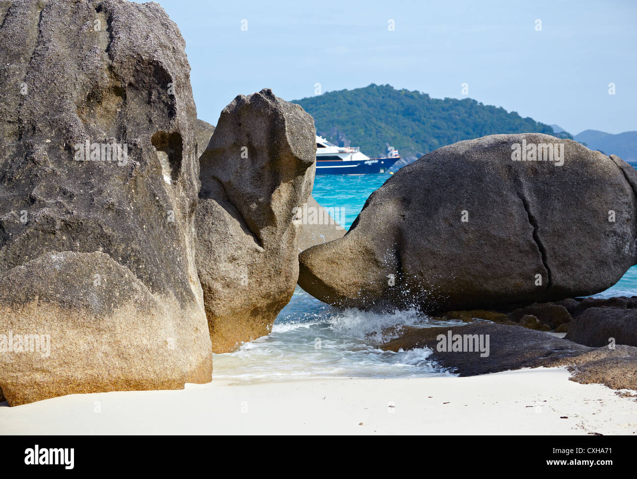Boulders ship and ocean Stock Photo - Alamy