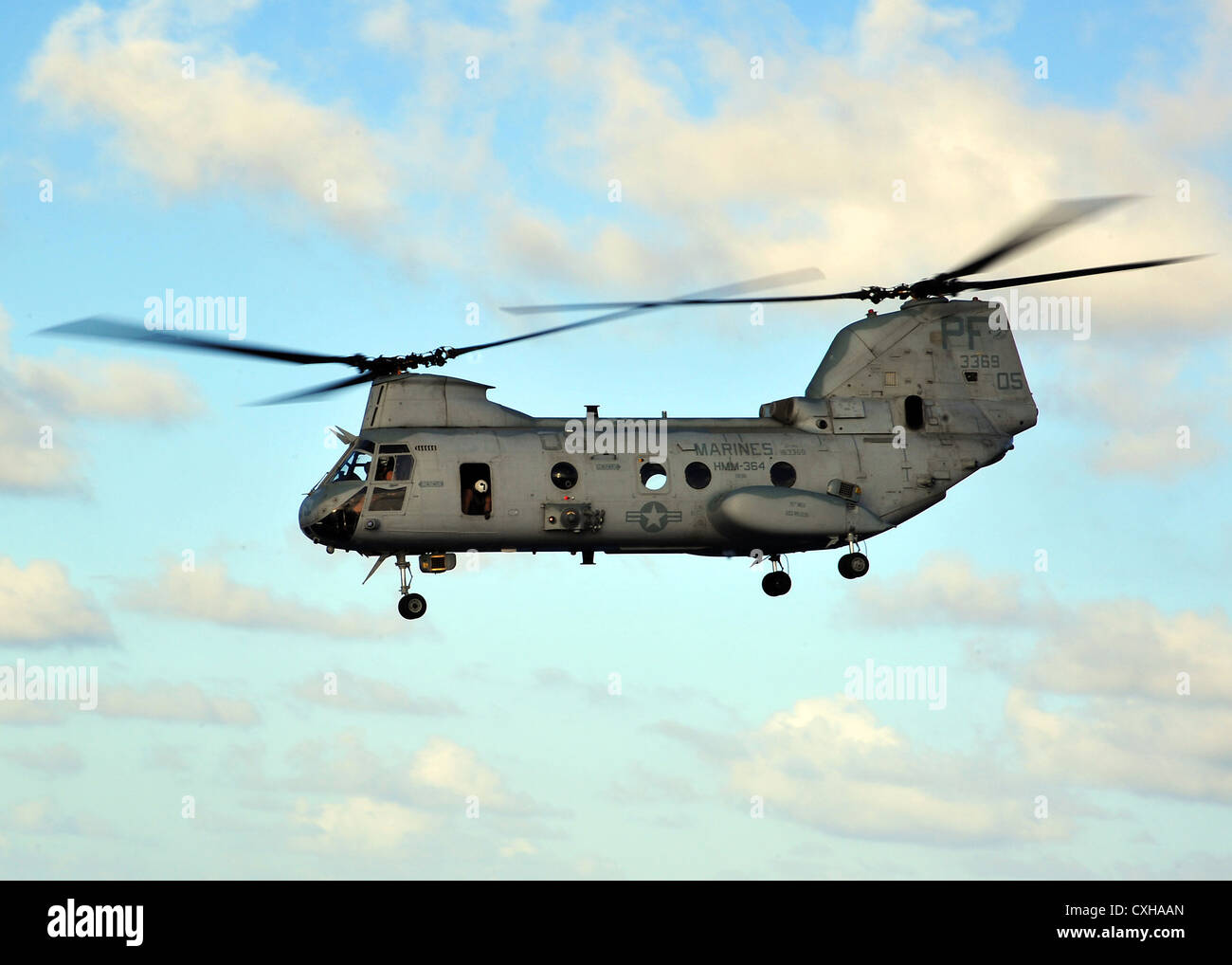 A CH-46E Sea Knight helicopter departs from amphibious dock landing ...