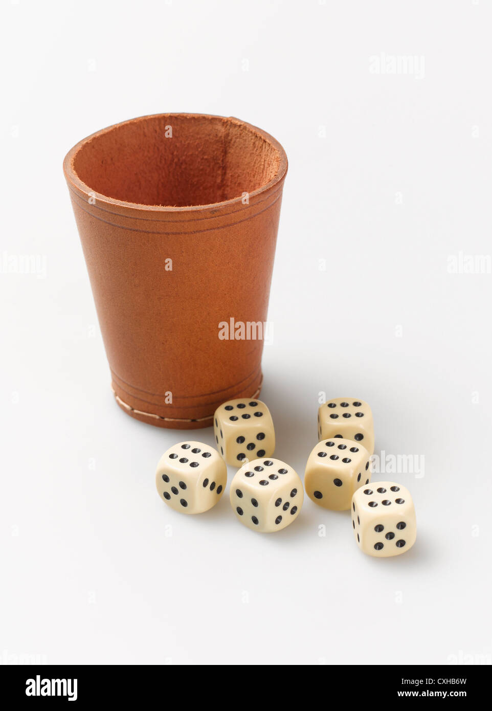 Dices with dice shaker on white background Stock Photo - Alamy