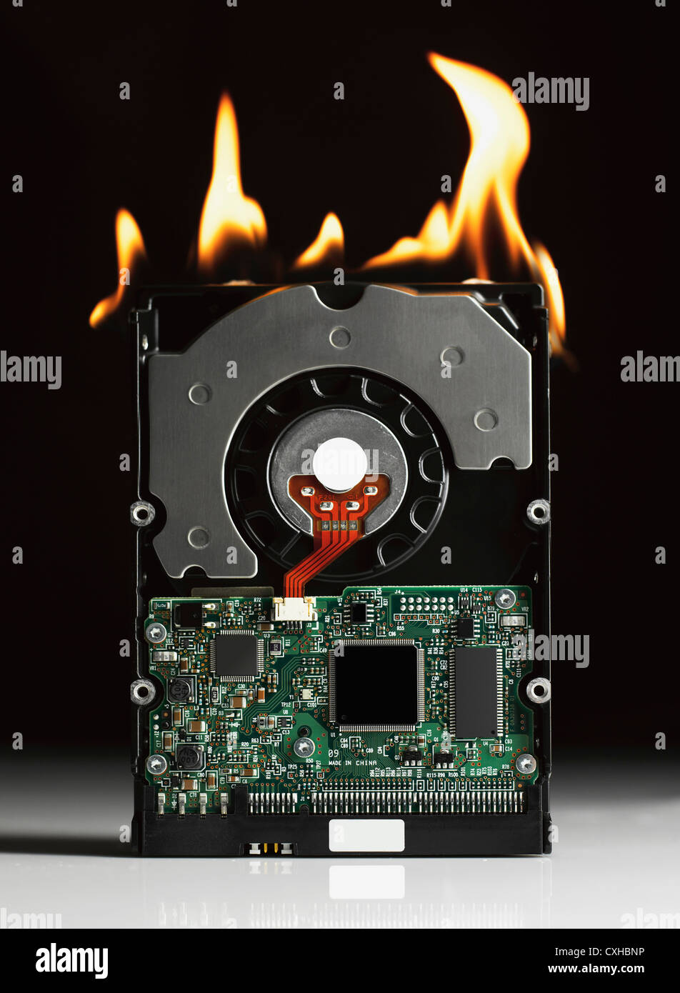 Burning hard disk on white background Stock Photo - Alamy