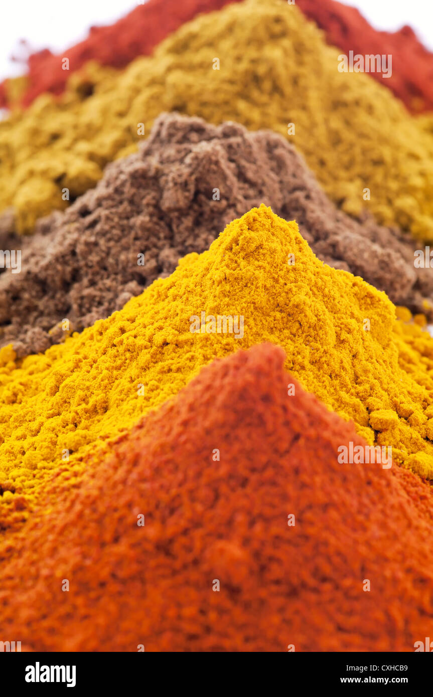 Spice mix with different exotically spices as closeup on white ...