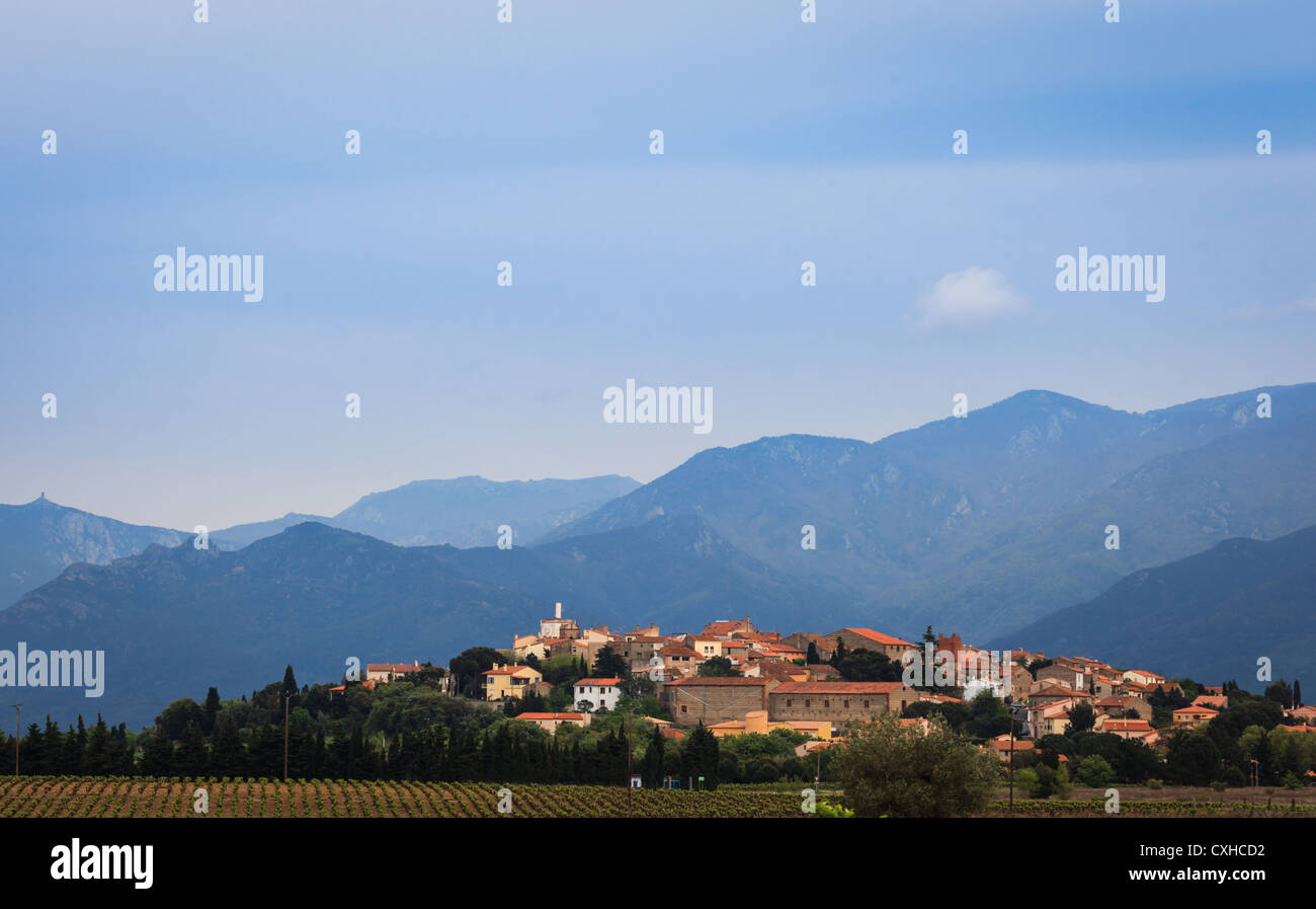 Pretty French village with red tile roof nestles in the Pyrenees ...