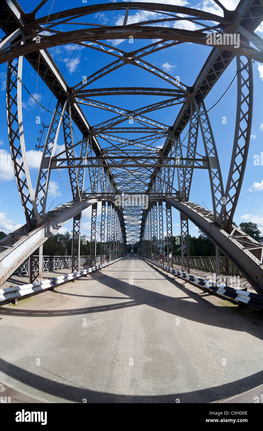Old arched metal bridge in Novgorod region, Russia. View from inside ...