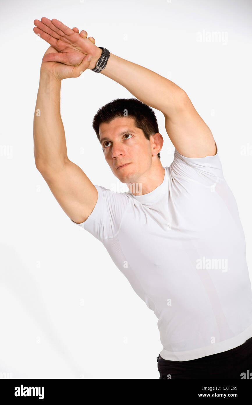Man stretching arm holding Cut Out Stock Images & Pictures - Alamy