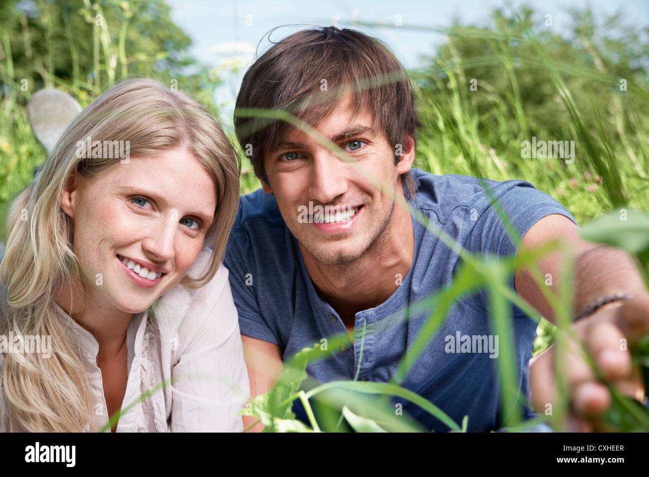 Germany, Cologne, Young couple smiling, potrait Stock Photo - Alamy