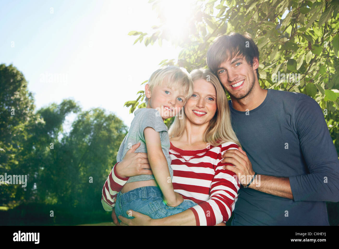 Germany, Cologne, Family smiling, portrait Stock Photo - Alamy