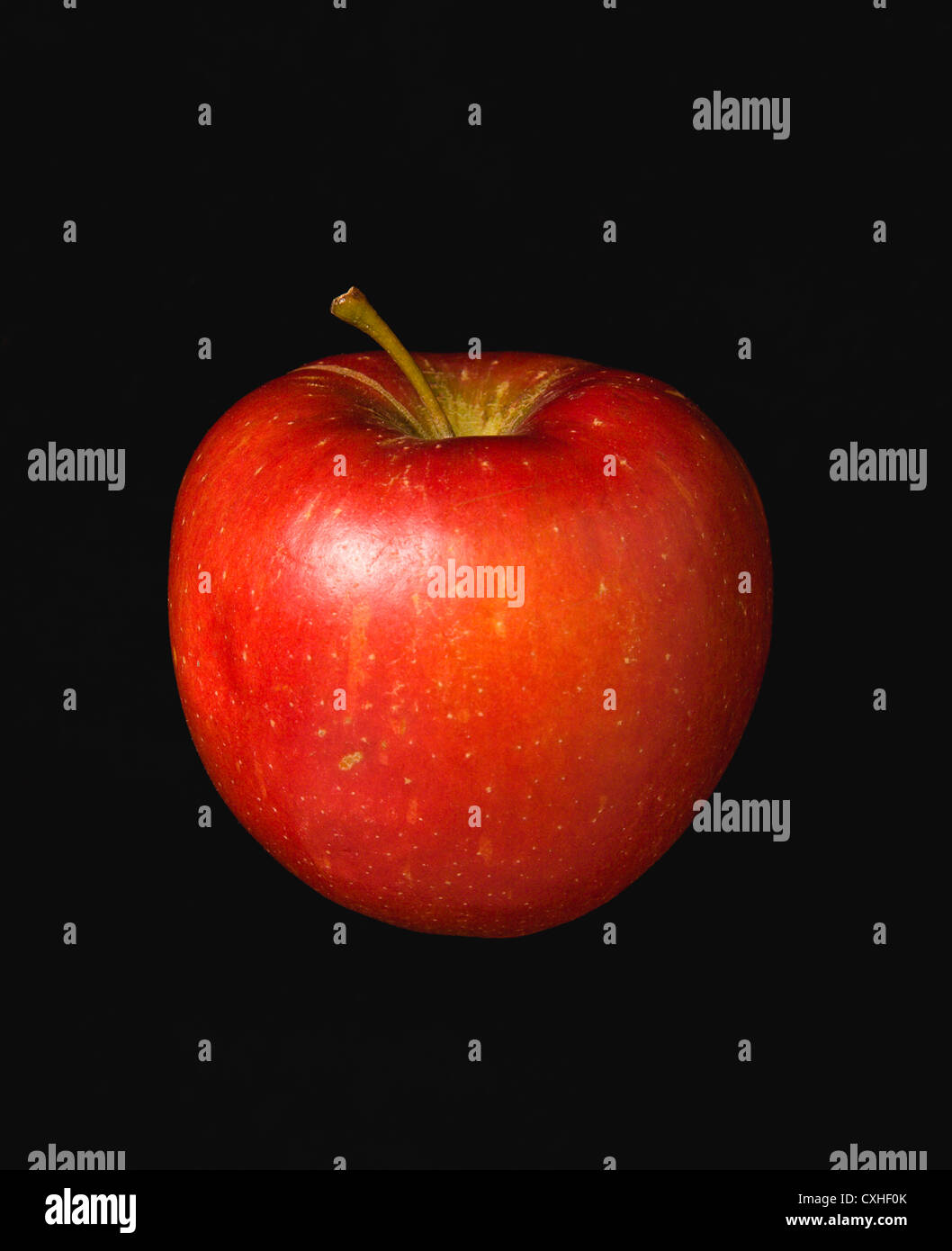 Red apple against black background Stock Photo - Alamy