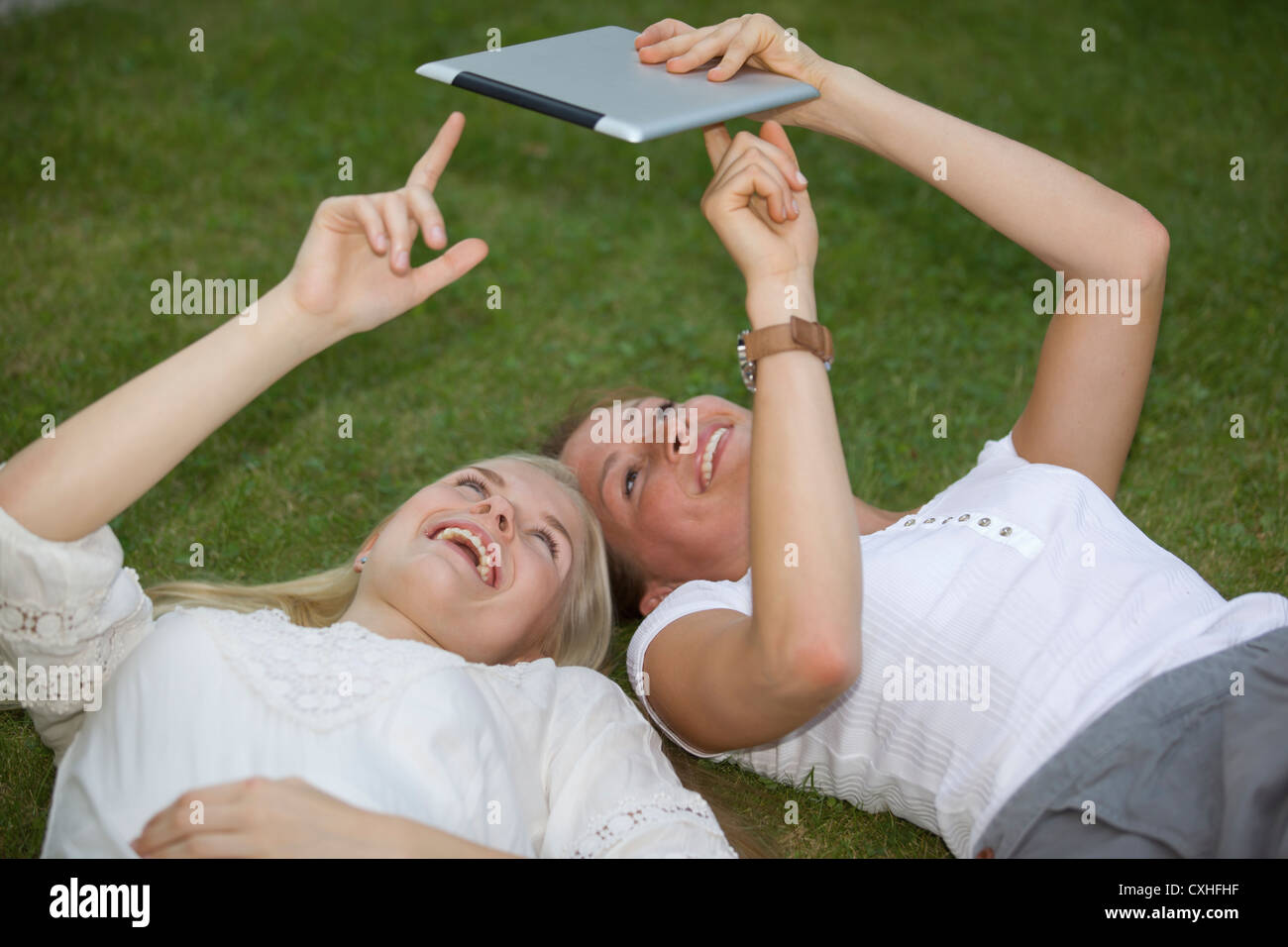 Germany, North Rhine Westphalia, Cologne, Young students using digital ...