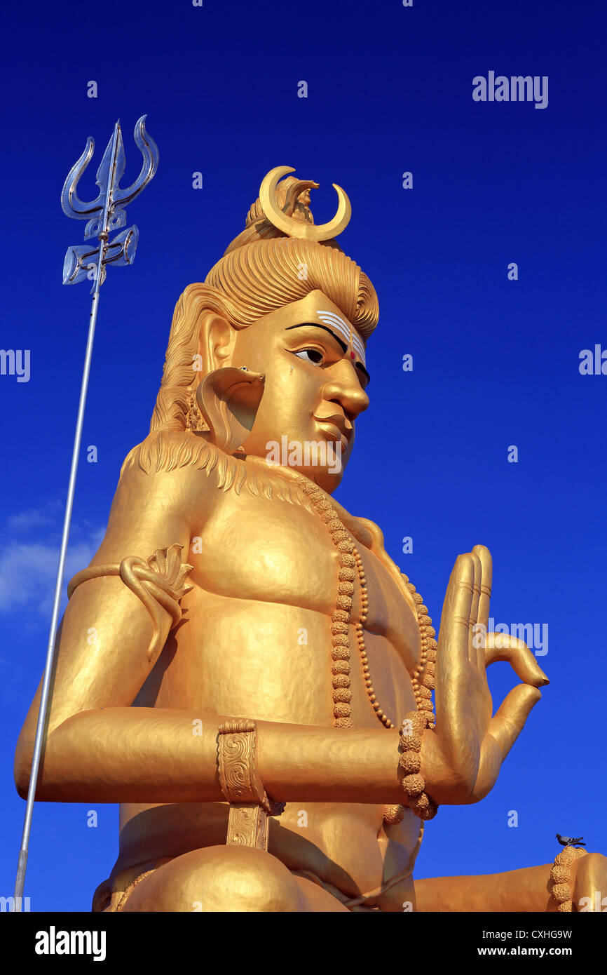 Statue of the Hindu god Shiva with trident spear (trisula, trishula) at ...