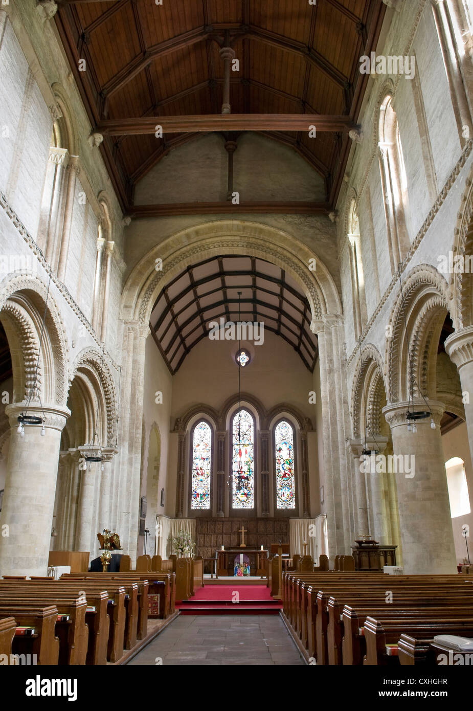 Prominent Norman arches in The church of St Andrew and St Cuthman Stock ...