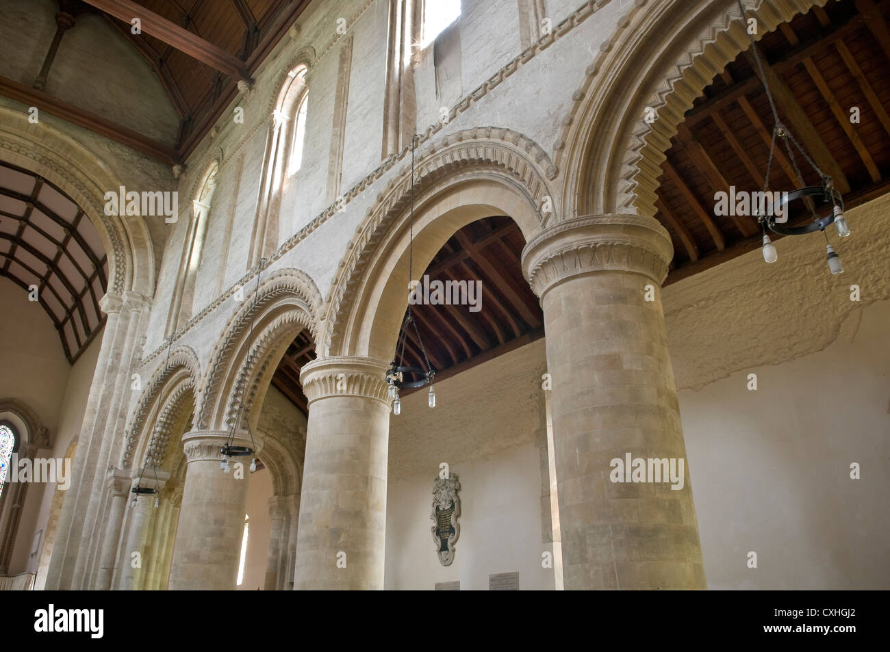 Prominent Norman arches in The church of St Andrew and St Cuthman ...